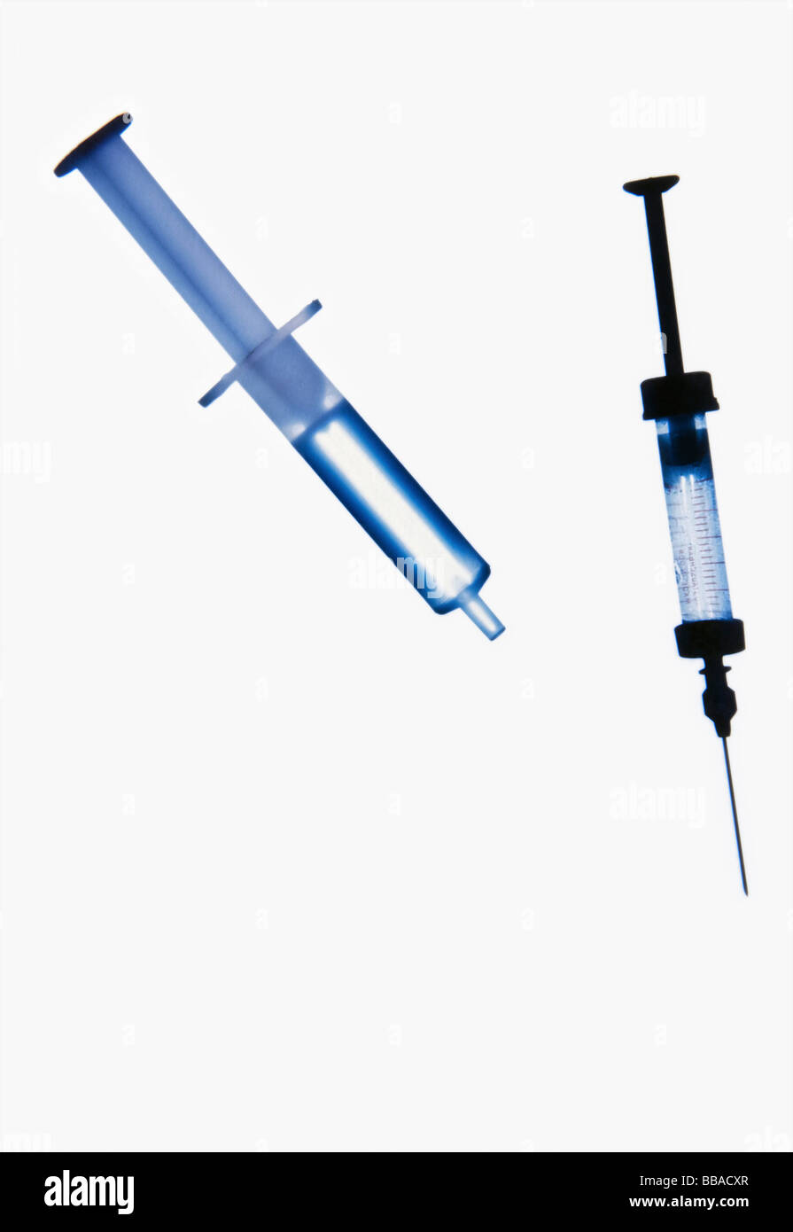 Two syringes Cut Out Stock Images & Pictures - Alamy