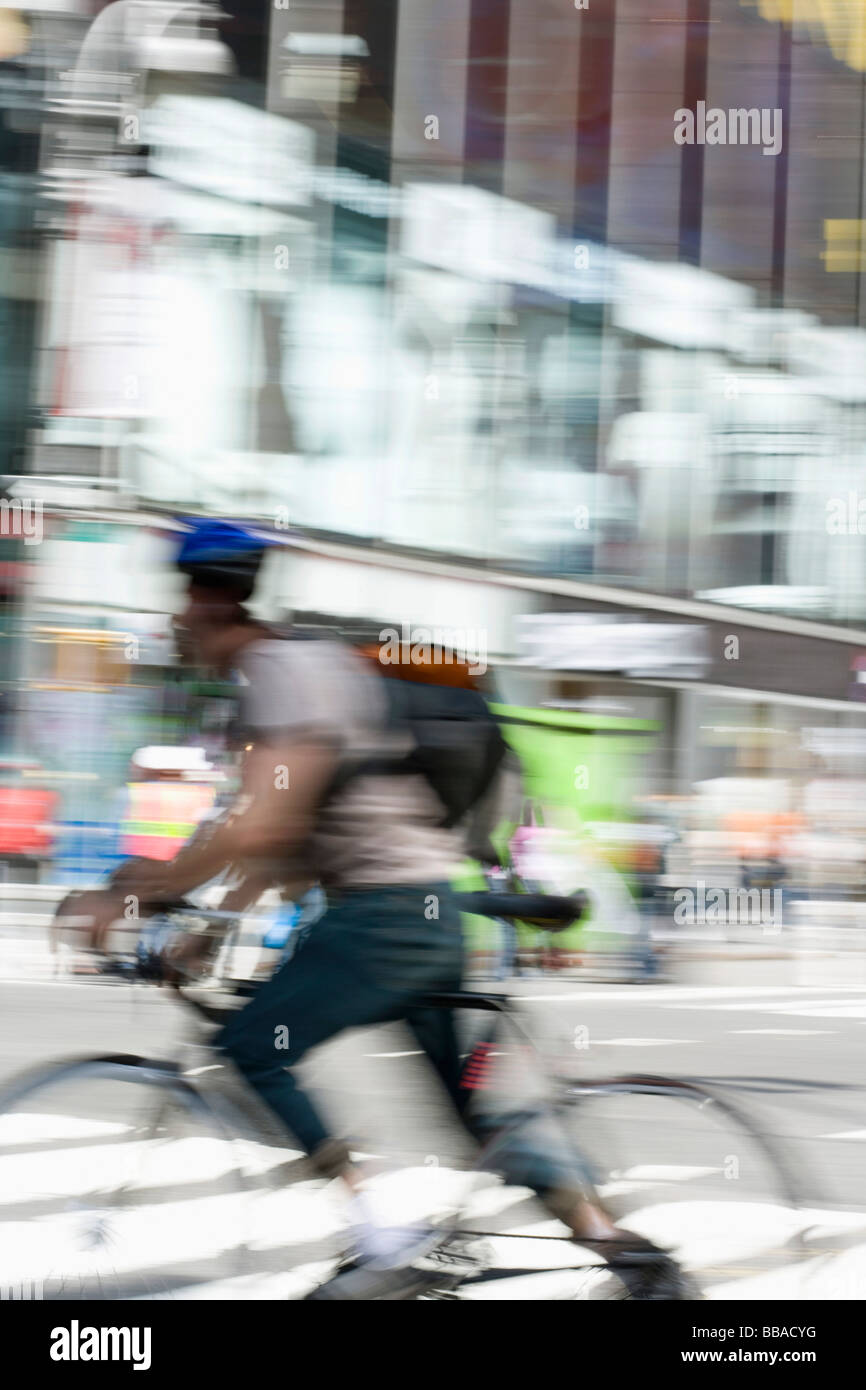 A cyclist on a city street, Manhattan, New York City Stock Photo - Alamy