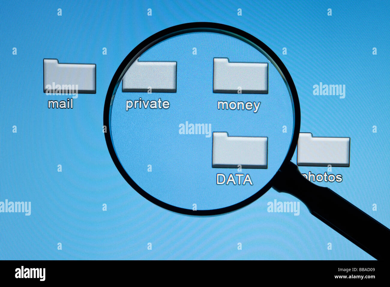 A magnifying glass in front of a computer screen Stock Photo - Alamy