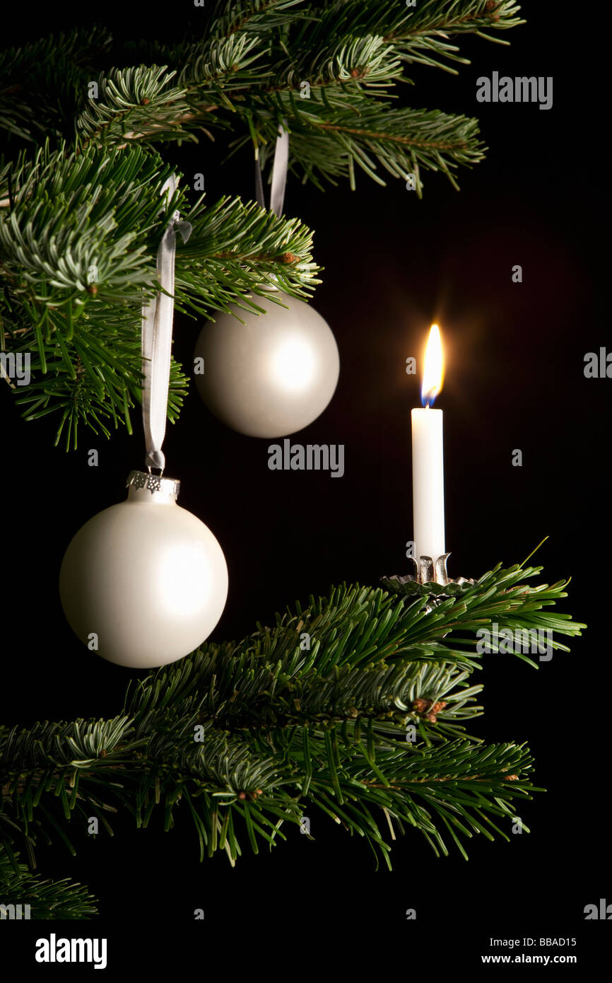 Decoration and a candle on a Christmas Tree Stock Photo - Alamy