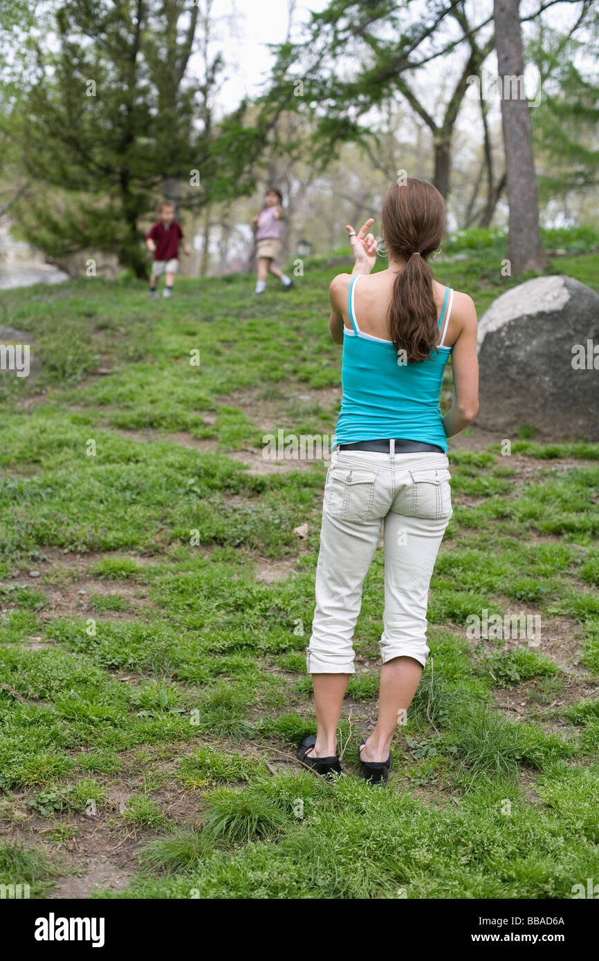 A mother beckoning her children in Central Park, New York City Stock ...