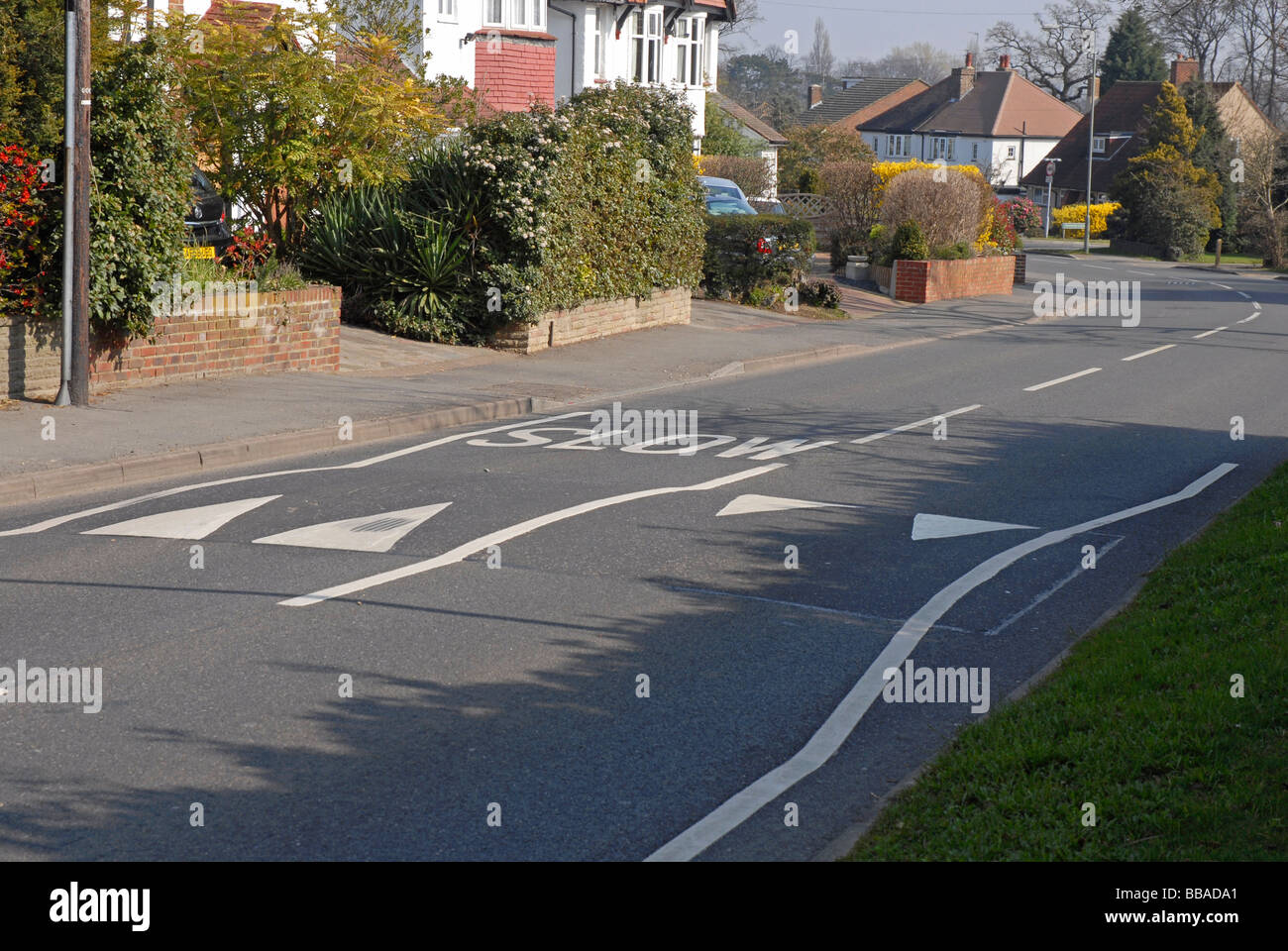 Traffic calming humps in suburban street Stock Photo - Alamy