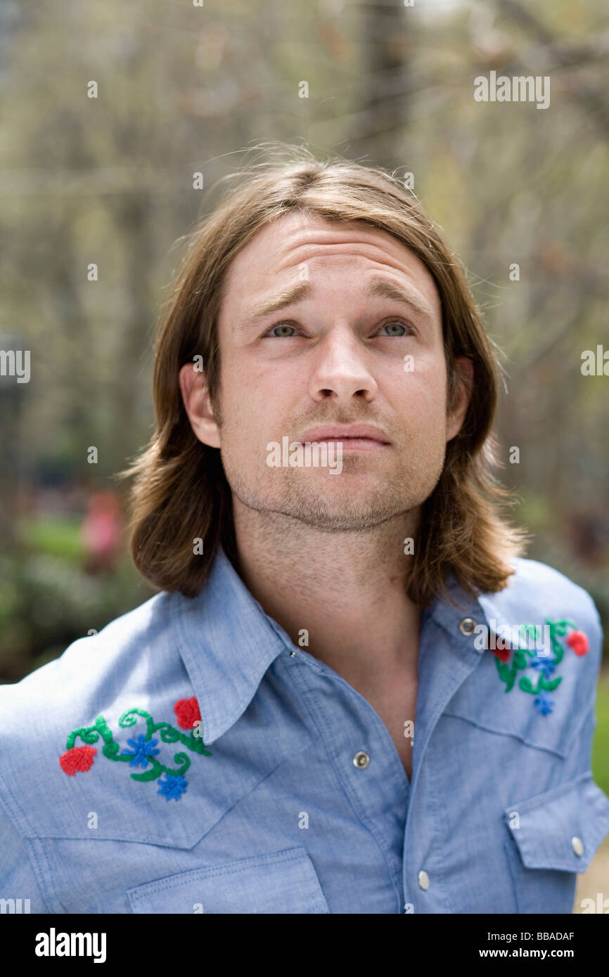 A young man looking up Stock Photo - Alamy