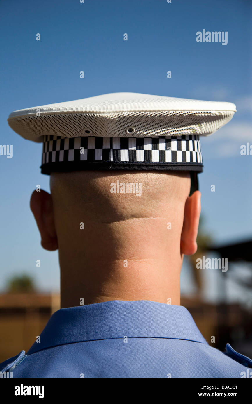 Rear view of a policeman Stock Photo - Alamy