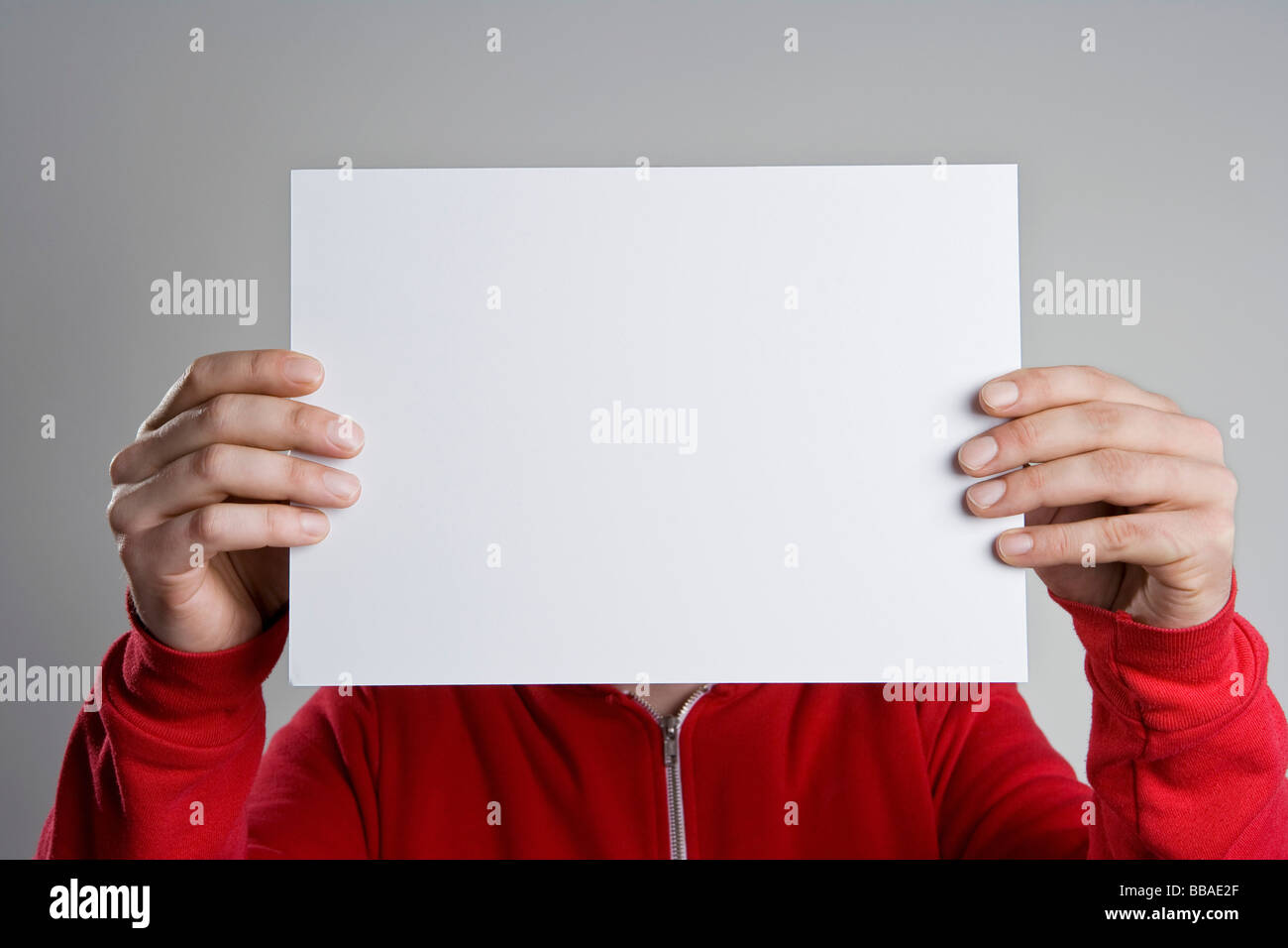 A Man Holding A Blank Sheet Of Paper Stock Photo Alamy a-man-holding-a-blank-sheet-of-paper-stock-photo-alamy