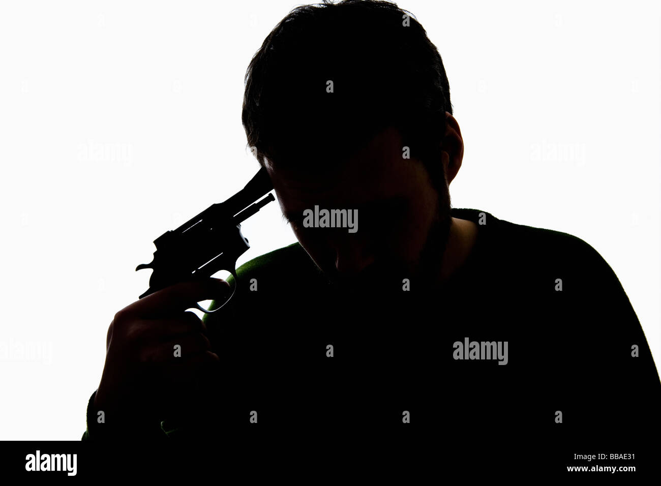 A man holding a gun to his head Stock Photo - Alamy