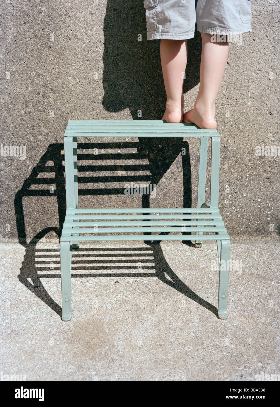 A boys legs standing on a step ladder hi-res stock photography and ...