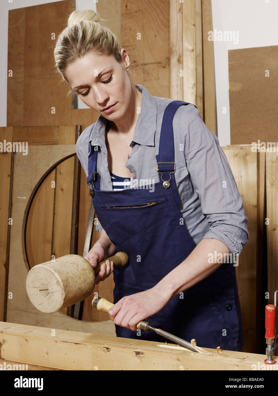 Woman chiseling wood hi-res stock photography and images - Alamy