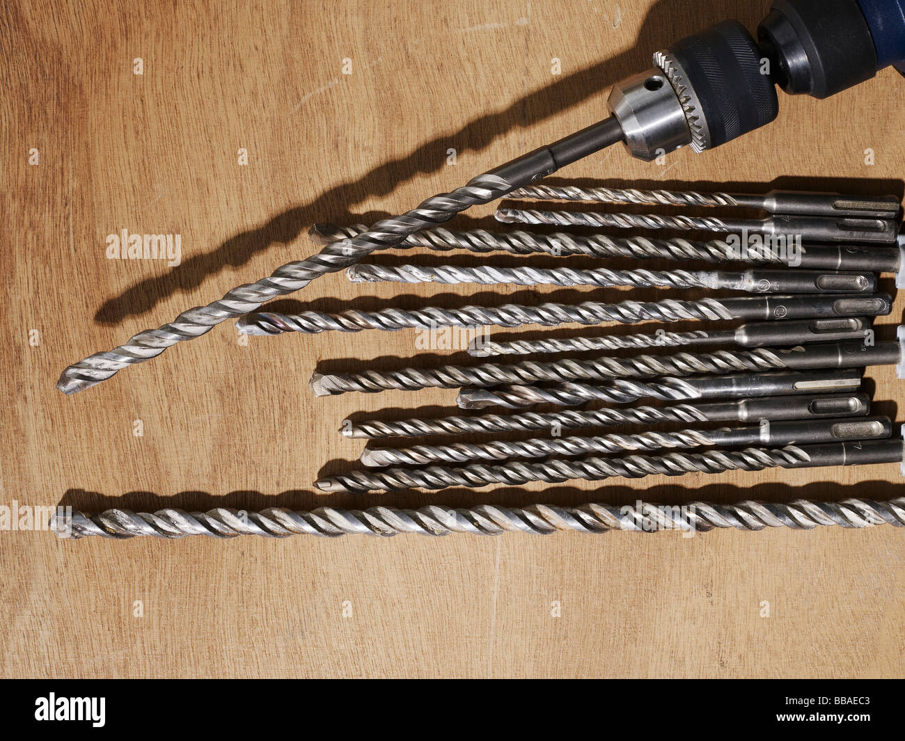 A drill and assorted drill bits on a bench Stock Photo - Alamy