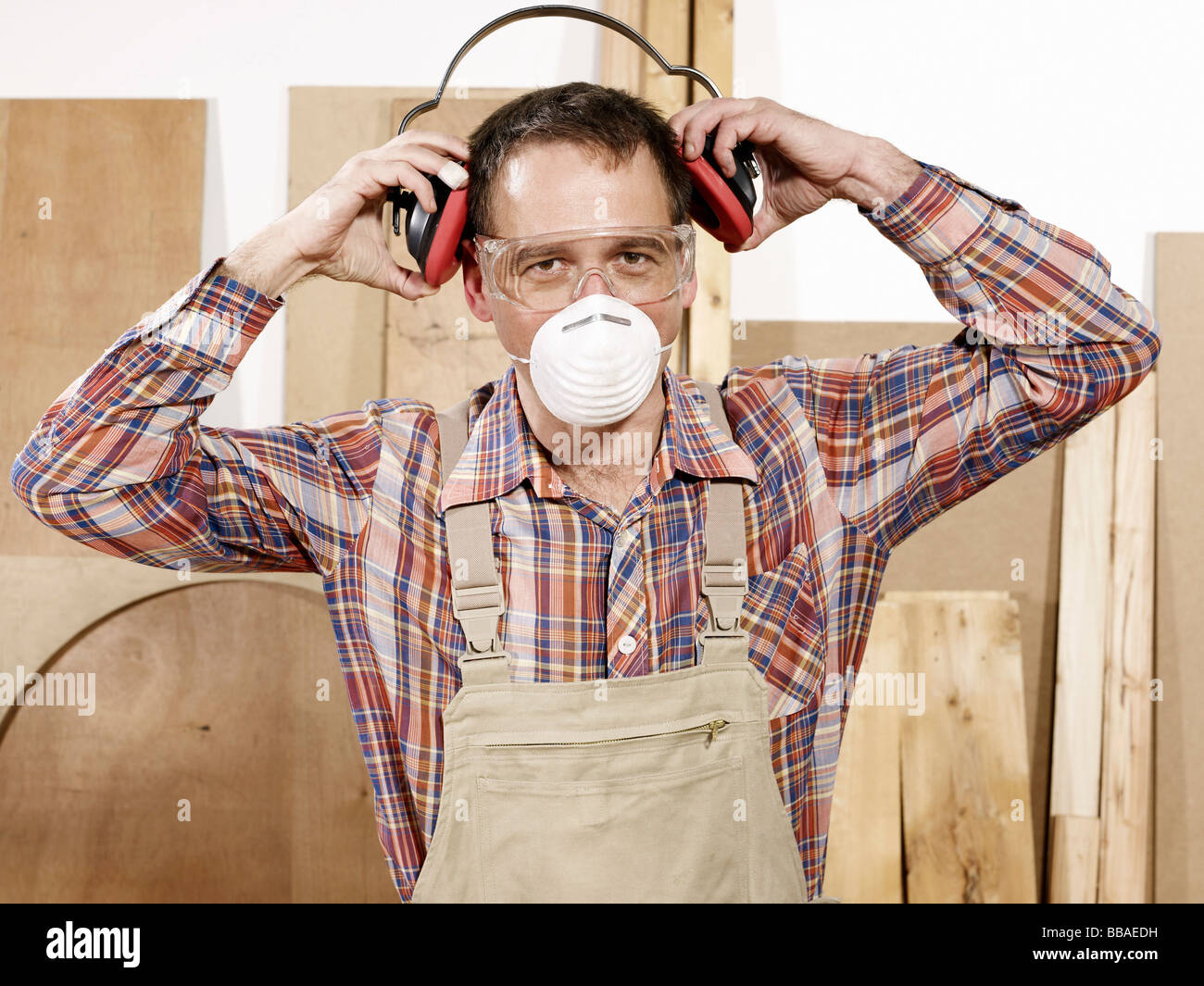 Putting on a mask hi-res stock photography and images - Alamy
