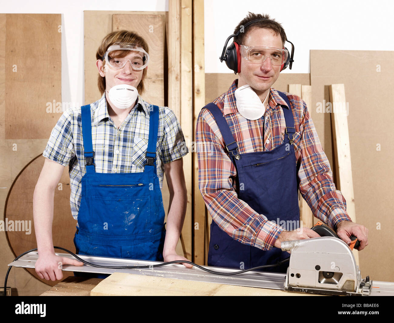 Portrait of two men in a wood workshop Stock Photo - Alamy