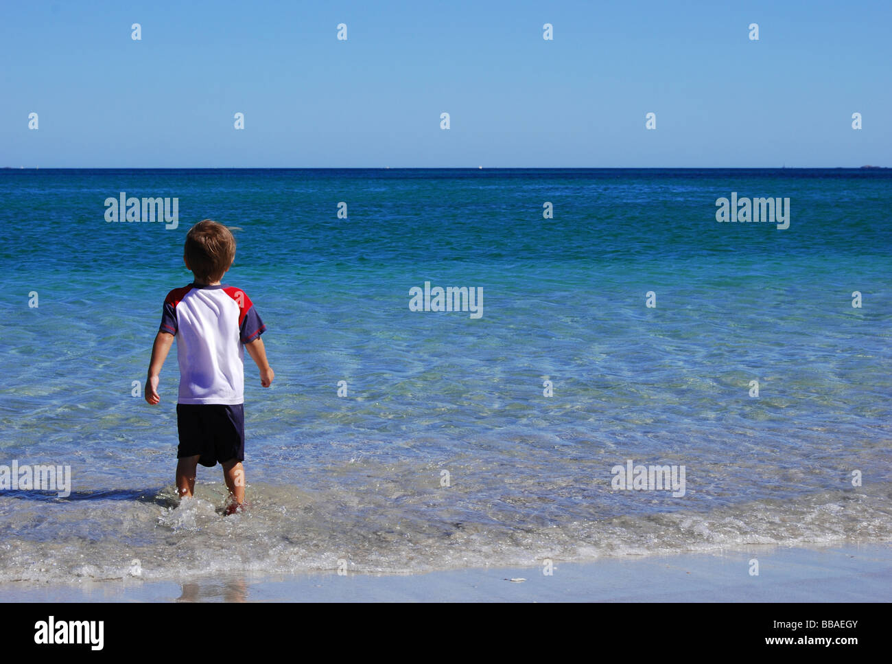 Boy on Beach Stock Photo - Alamy