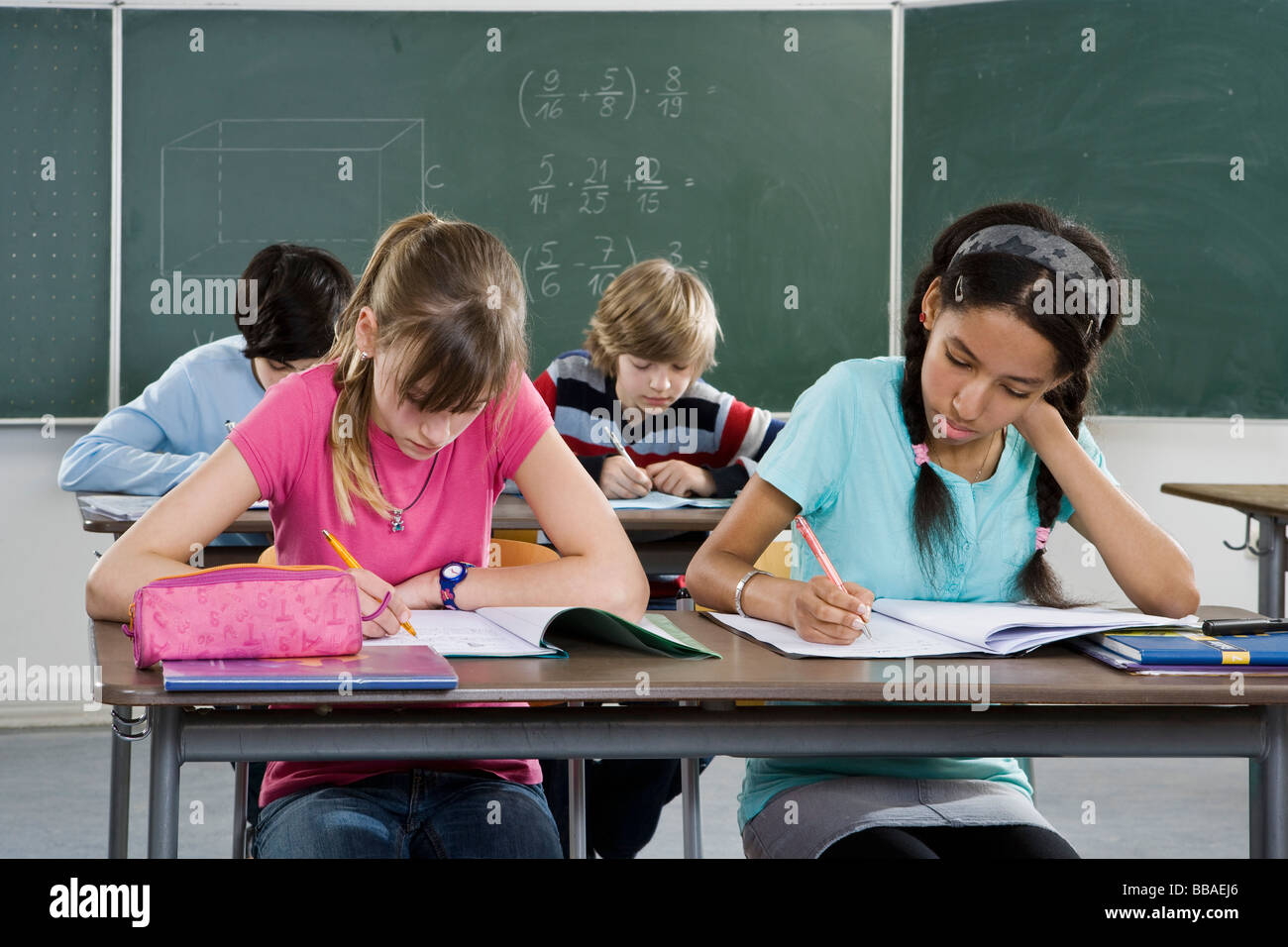 School students working in a classroom Stock Photo - Alamy