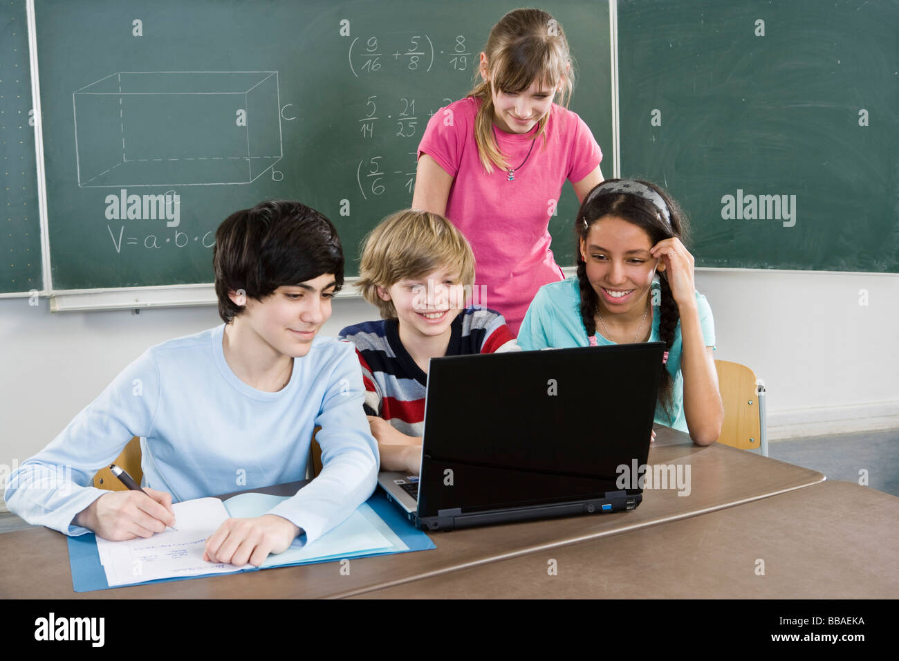 School students using a laptop Stock Photo - Alamy