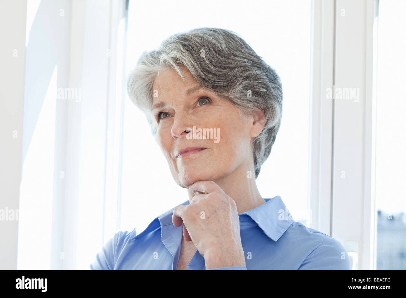 A senior woman thinking, portrait Stock Photo - Alamy