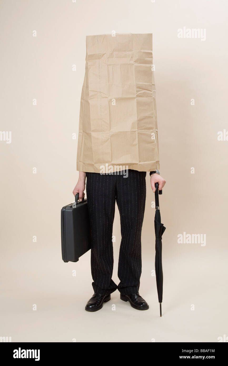 A businessman wearing a large paper bag Stock Photo - Alamy