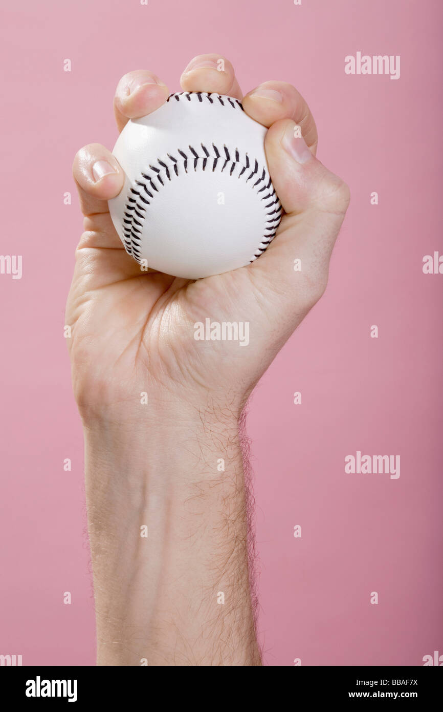 A human hand holding a baseball Stock Photo - Alamy