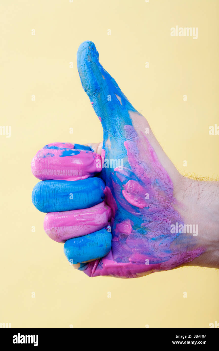 A human hand with paint on it giving a thumbs up Stock Photo - Alamy
