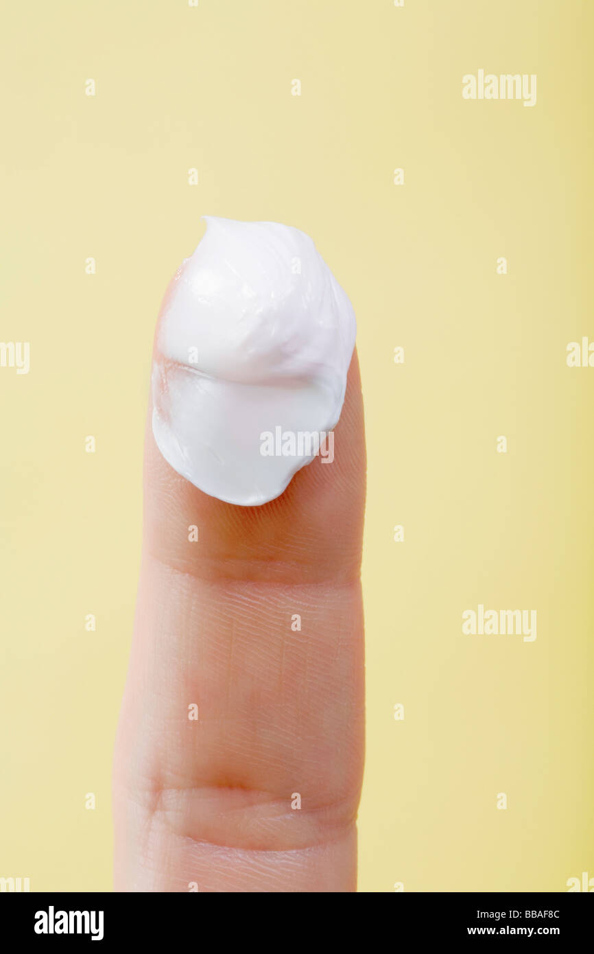 A human finger with lotion on it Stock Photo - Alamy