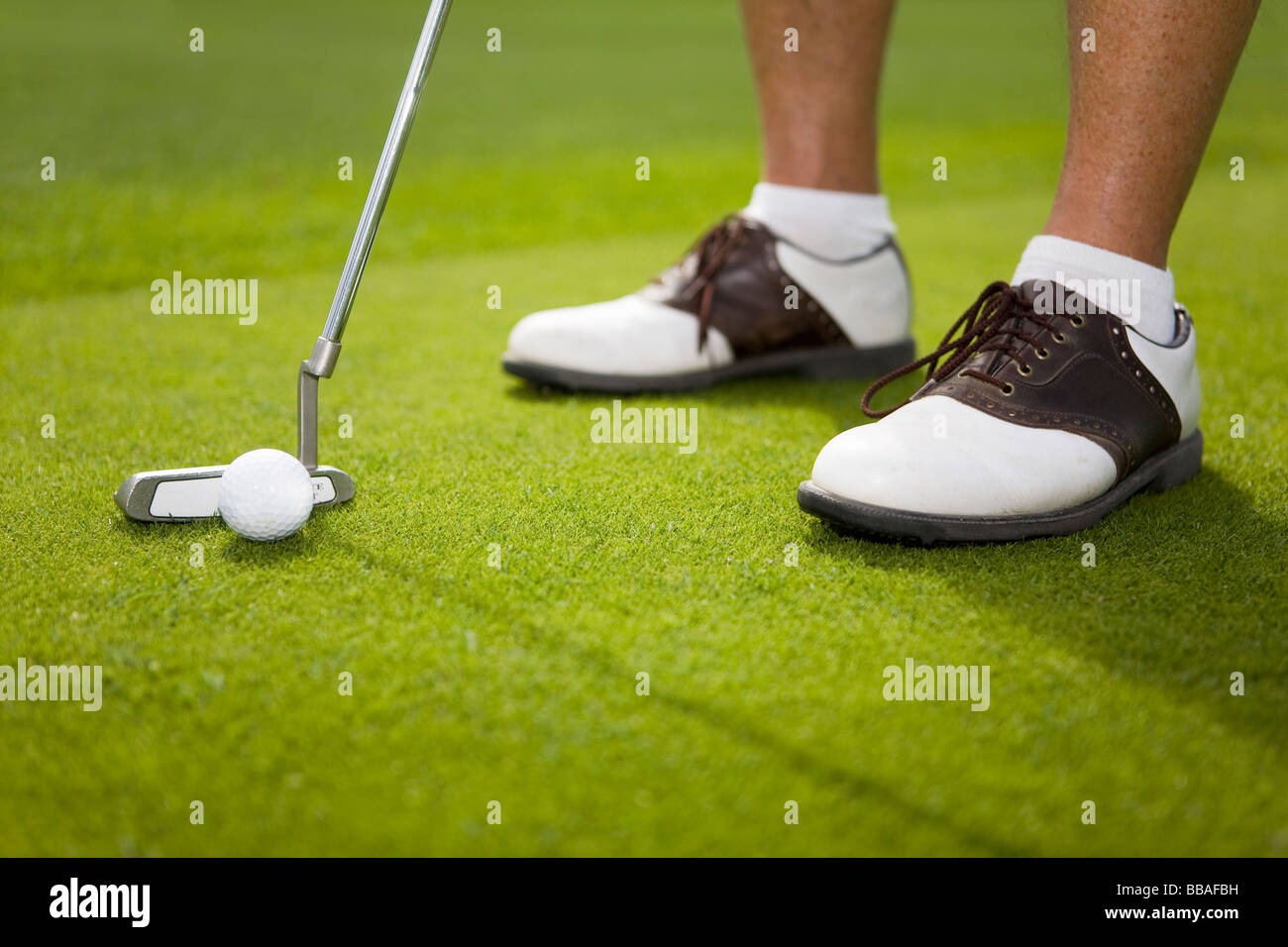 Detail of a golfer putting Stock Photo - Alamy