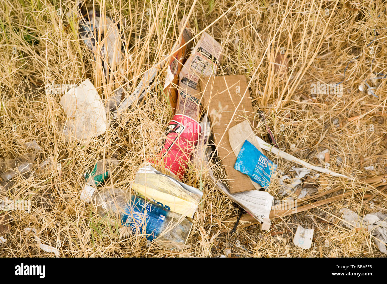 Discarded garbage in nature Stock Photo - Alamy