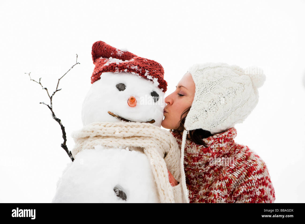 woman kissing snowman Stock Photo - Alamy