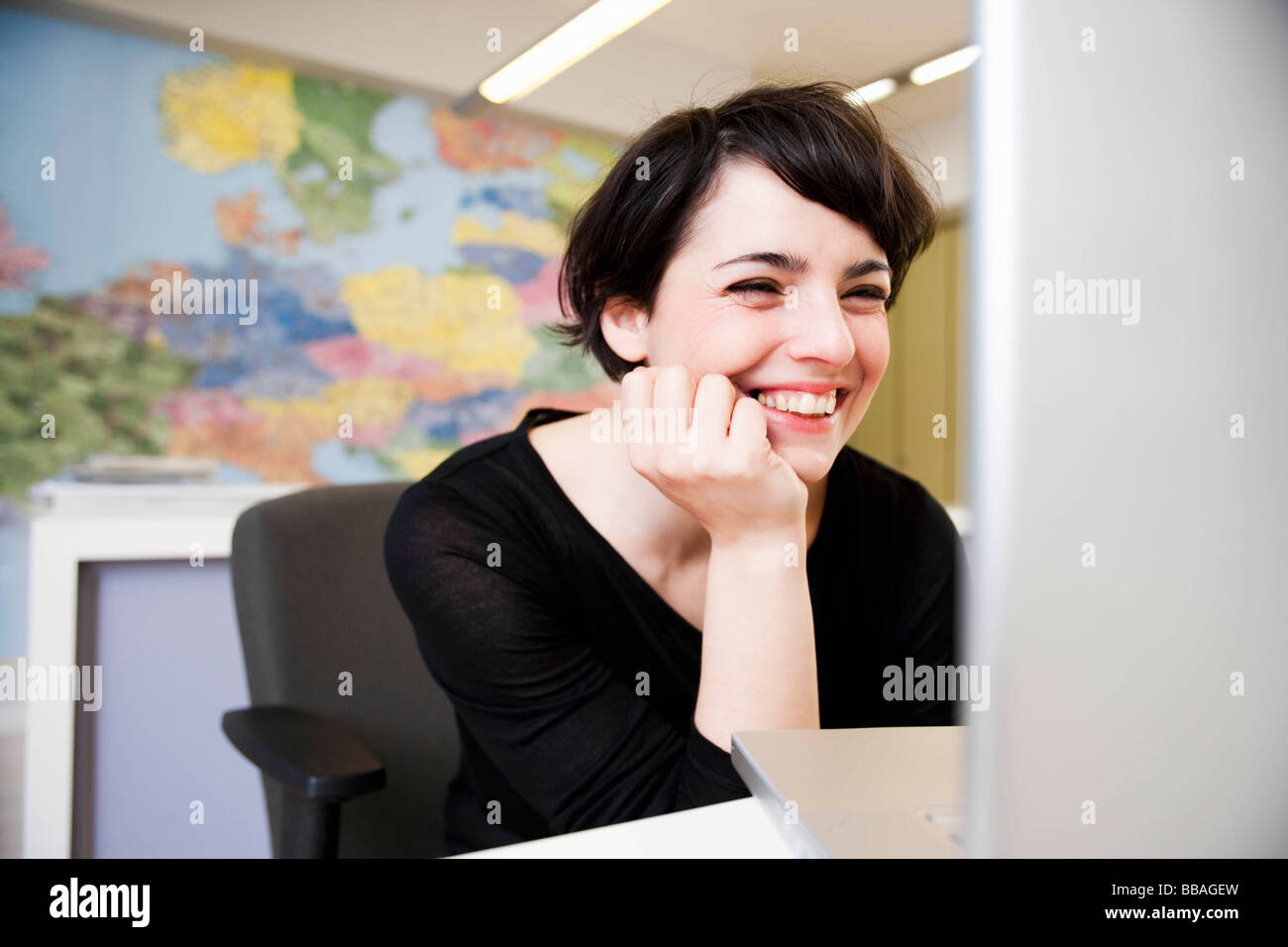 woman looking at computer Stock Photo - Alamy