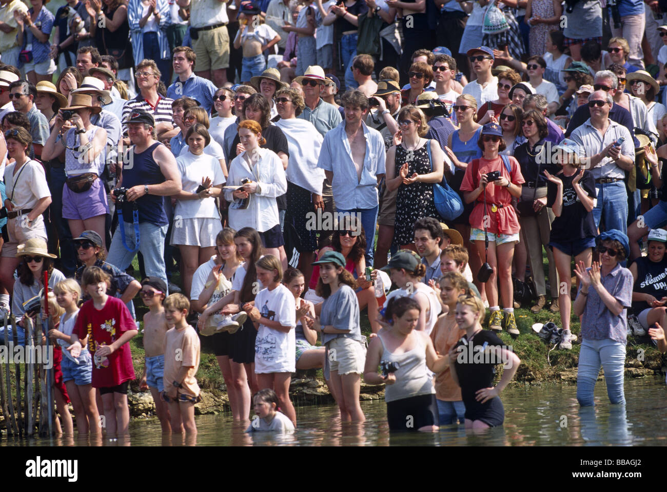 Spectators at Badminton horse trials stand in the famous lake to get a ...