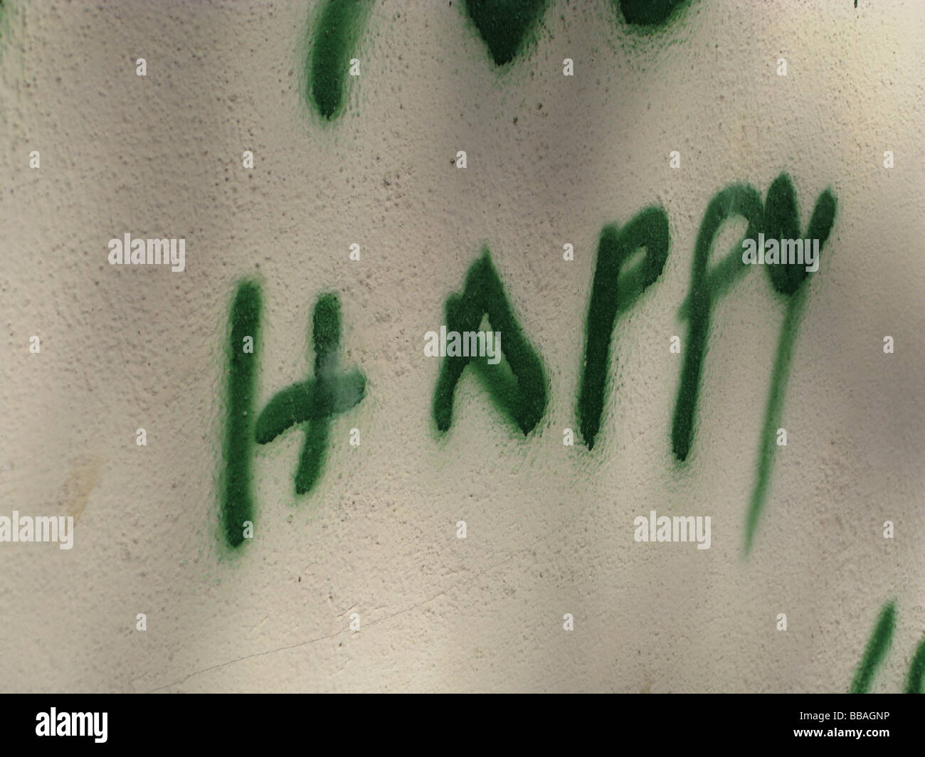 the word happy painted graffiti on wall in city town Stock Photo - Alamy