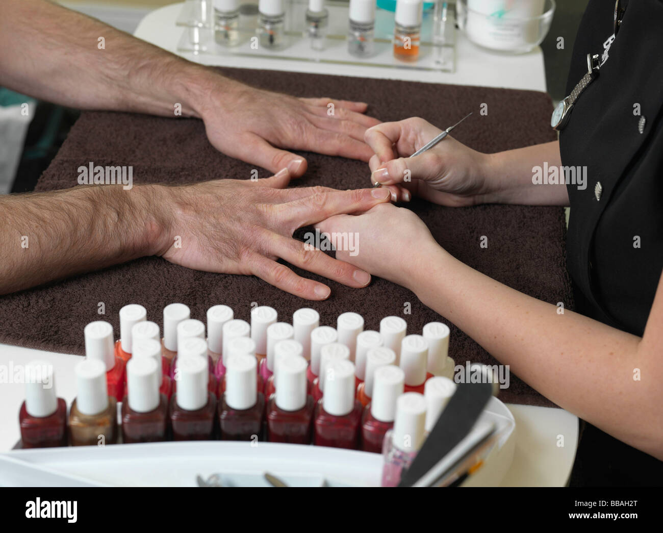 Young woman receiving manicure hi-res stock photography and images - Alamy