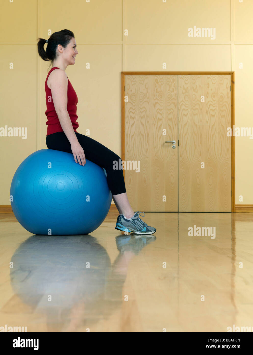 woman balancing on gym ball Stock Photo - Alamy