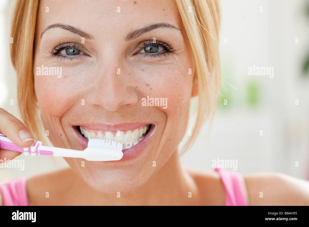young woman brushing teeth Stock Photo - Alamy