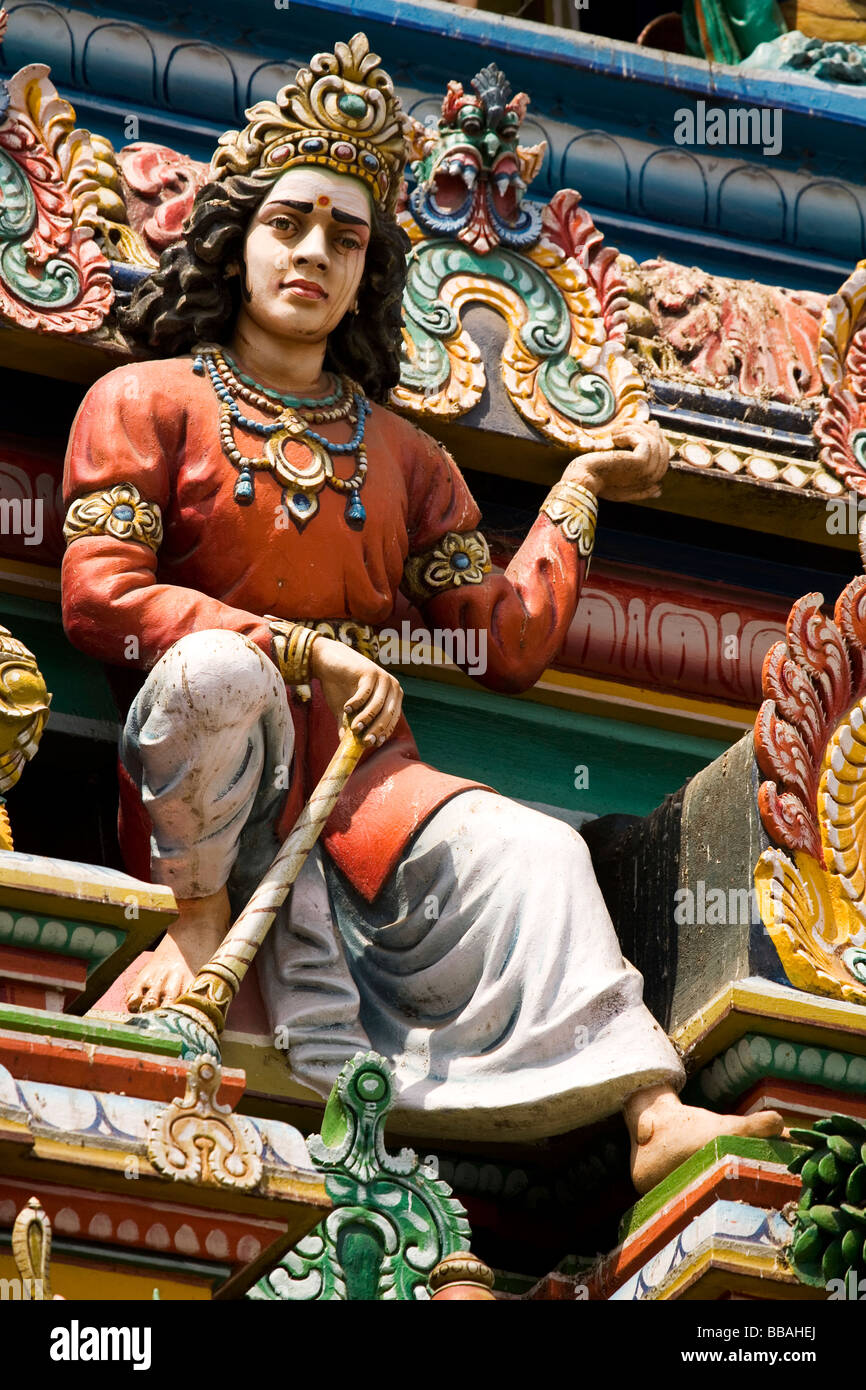 Detail showing one of the sculpted deities on the towered gateway ...