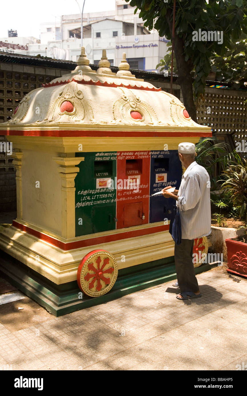 A man posts a letter in a chariot shaped postbox in Chennai, India ...