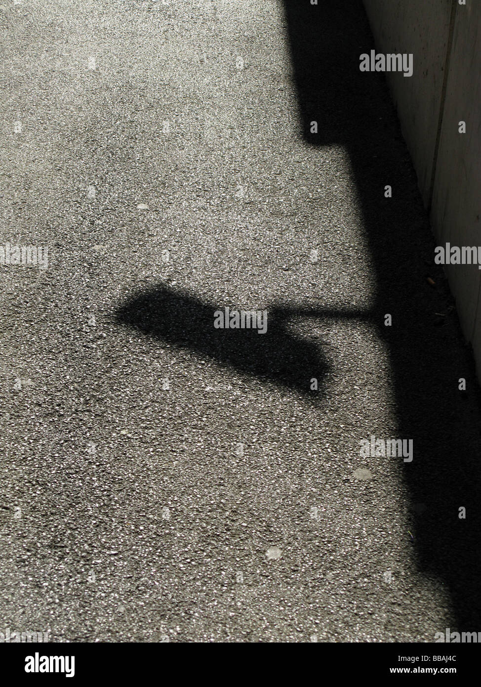 one cctv camera shadow in dark back alley in street in city town Stock ...