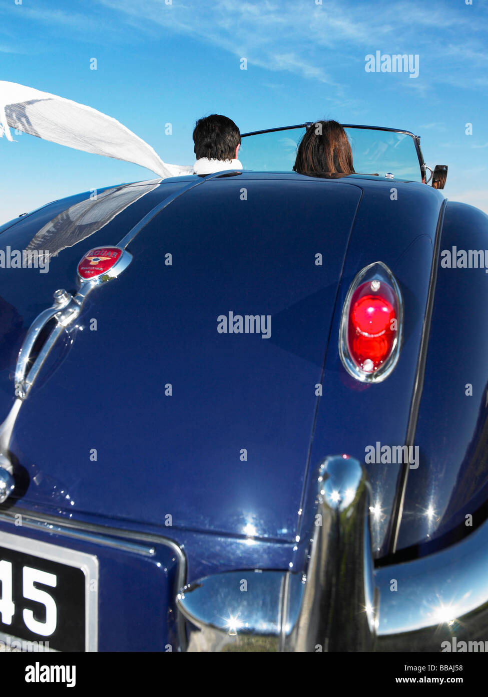 Couple in an old convertible Stock Photo - Alamy