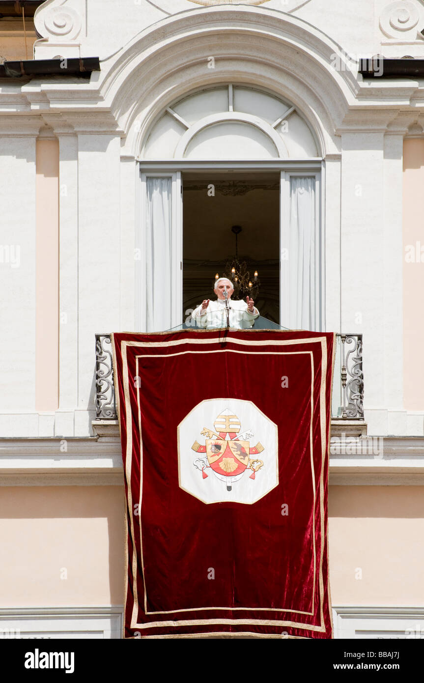 Pope Benedict XVI blesses the crowd from the balcony of the papal ...