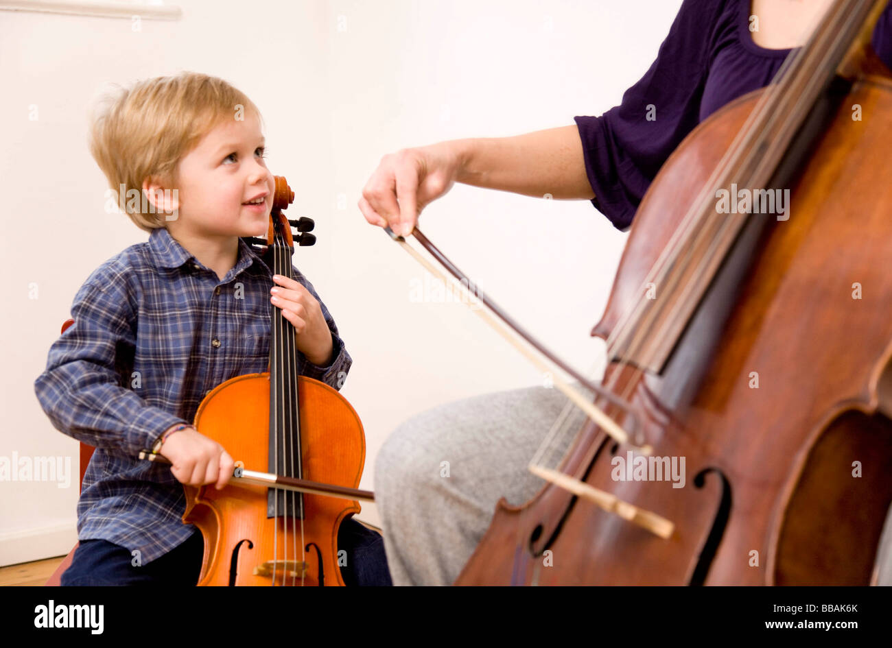 woman and boy playing Cello Stock Photo - Alamy