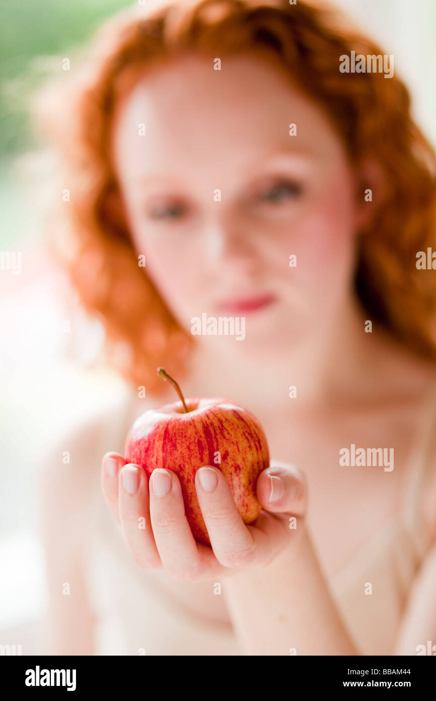 Girl holding apple Stock Photo - Alamy