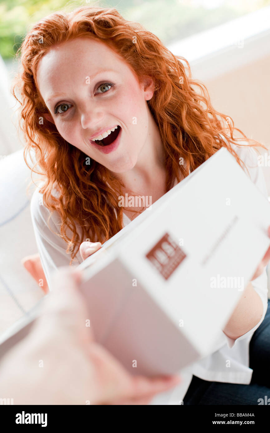 Woman receiving present Stock Photo - Alamy