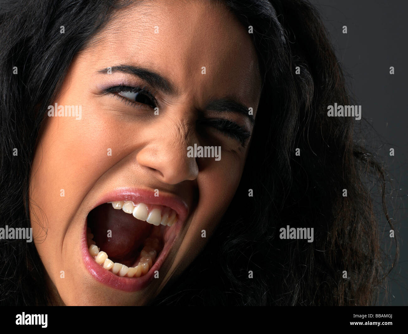 Young woman screaming Stock Photo - Alamy