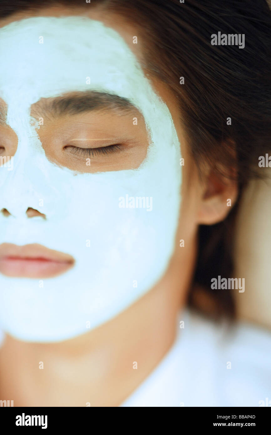Young man with facial mask, eyes closed Stock Photo - Alamy