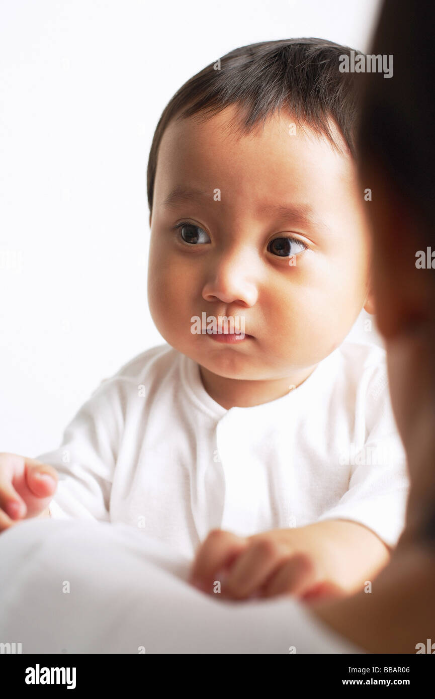 Baby boy looking away, over the shoulder view Stock Photo - Alamy