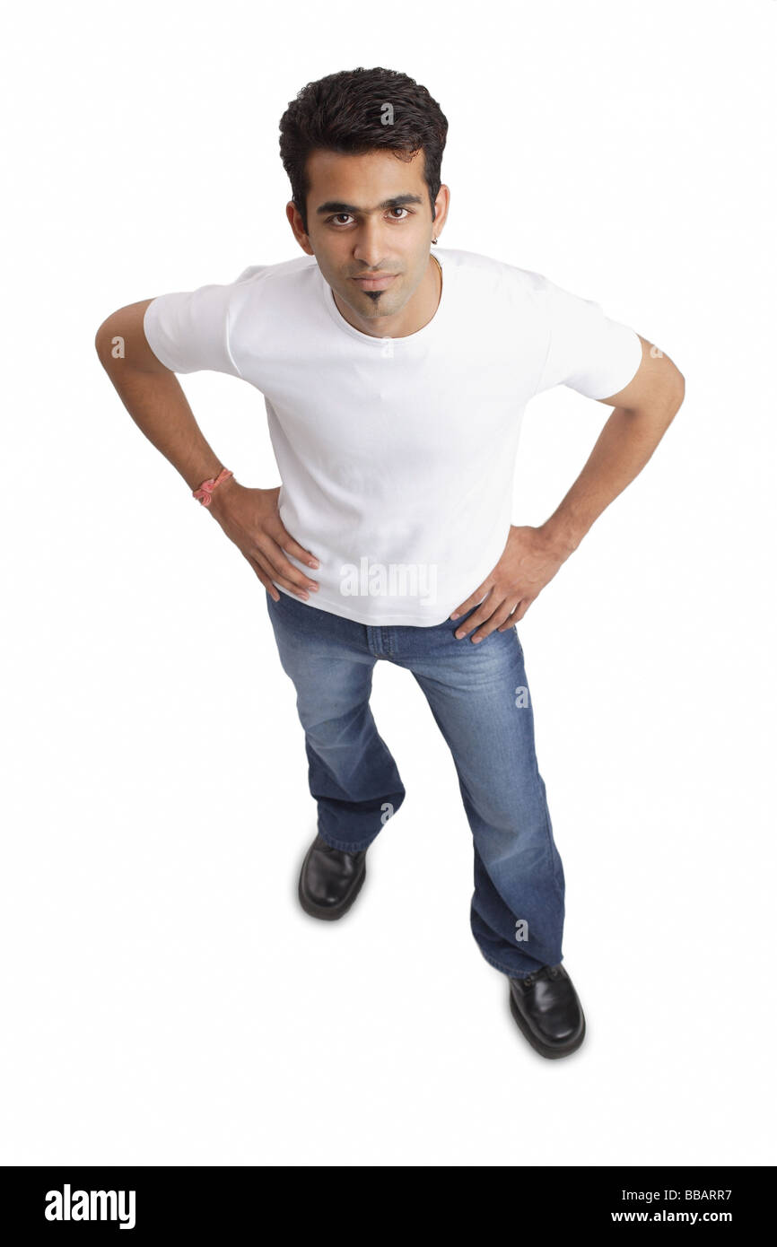Man looking at camera, hands on hip Stock Photo - Alamy