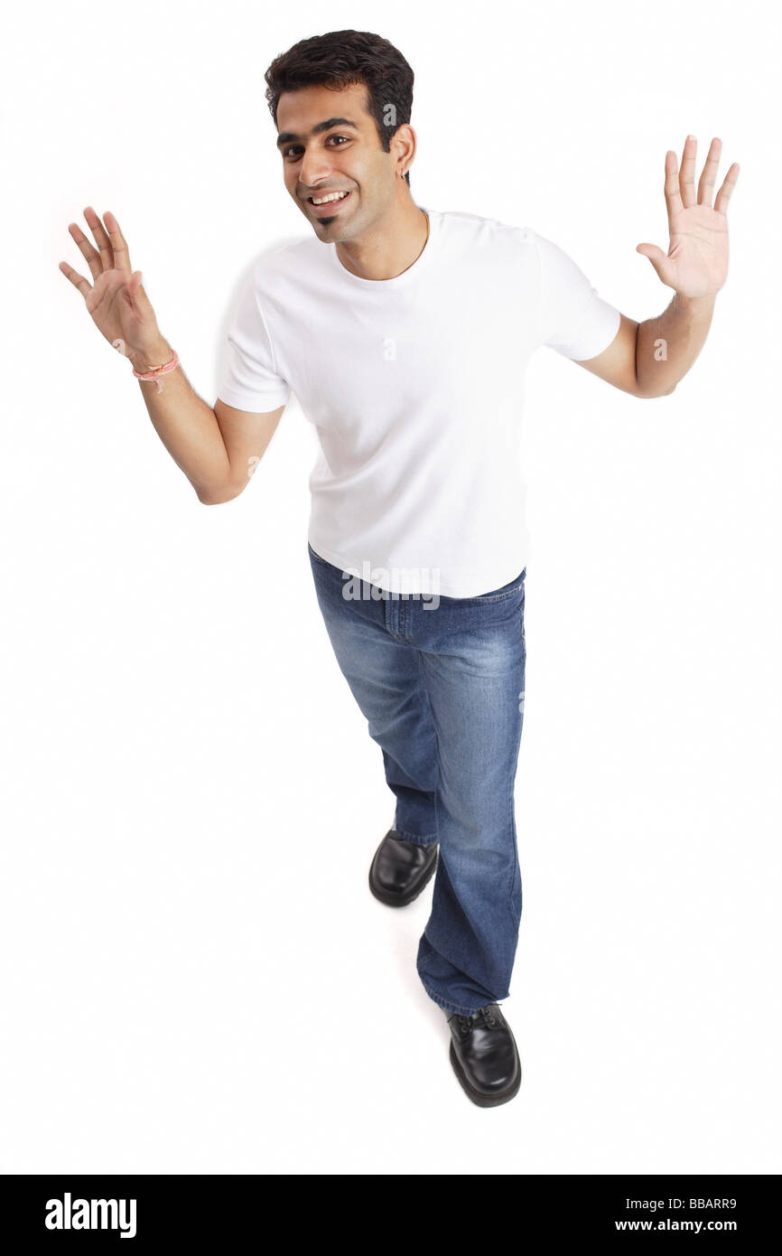 Man looking at camera, arms open, palms showing Stock Photo - Alamy
