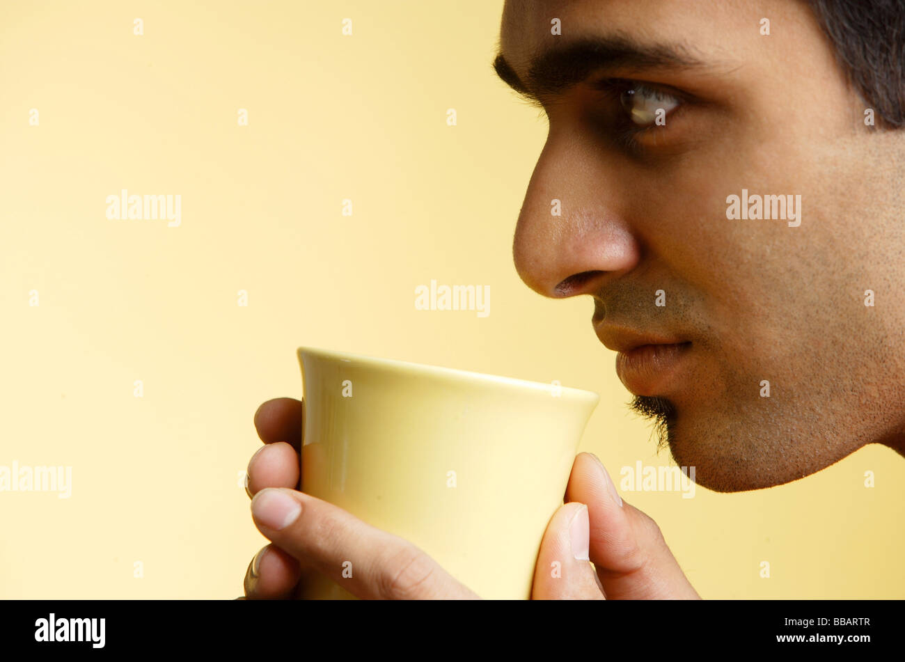 Man holding mug , profile Stock Photo - Alamy