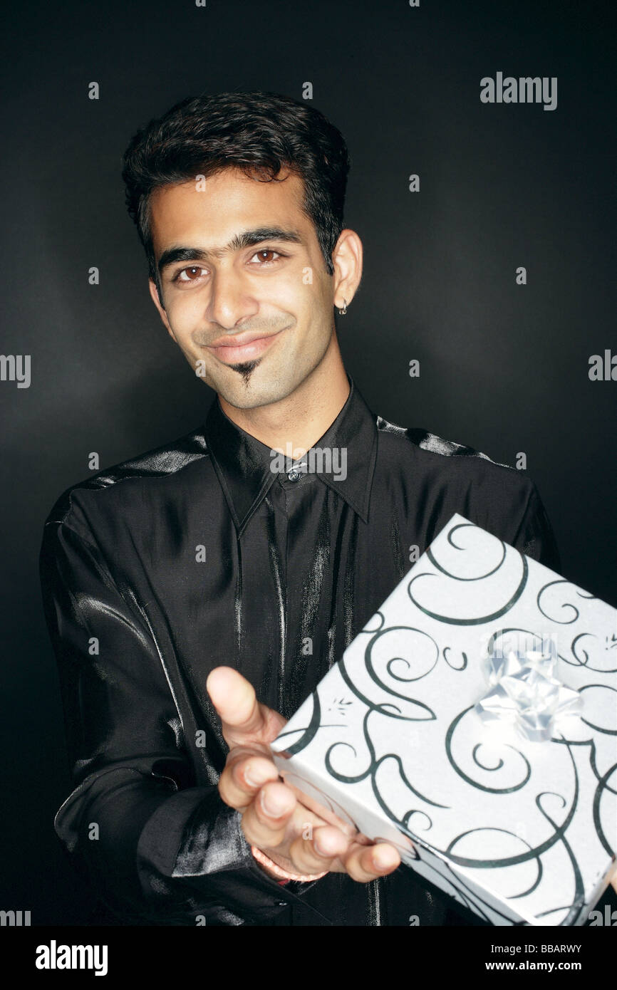 Man holding present Stock Photo - Alamy