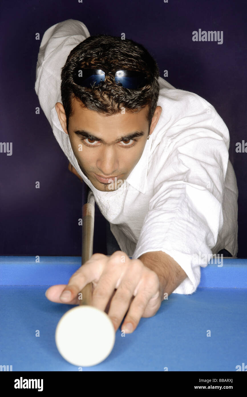 Young man playing pool, portrait Stock Photo - Alamy