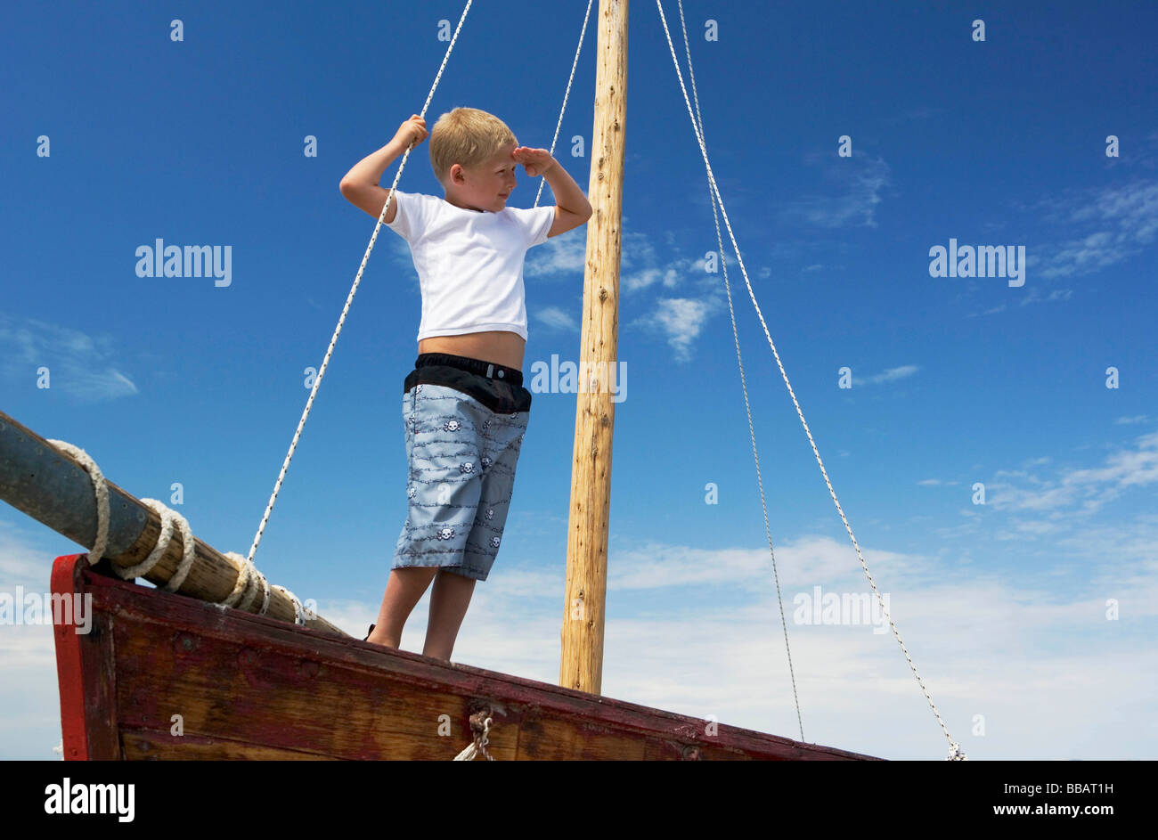 Boy on sailing boat Stock Photo - Alamy