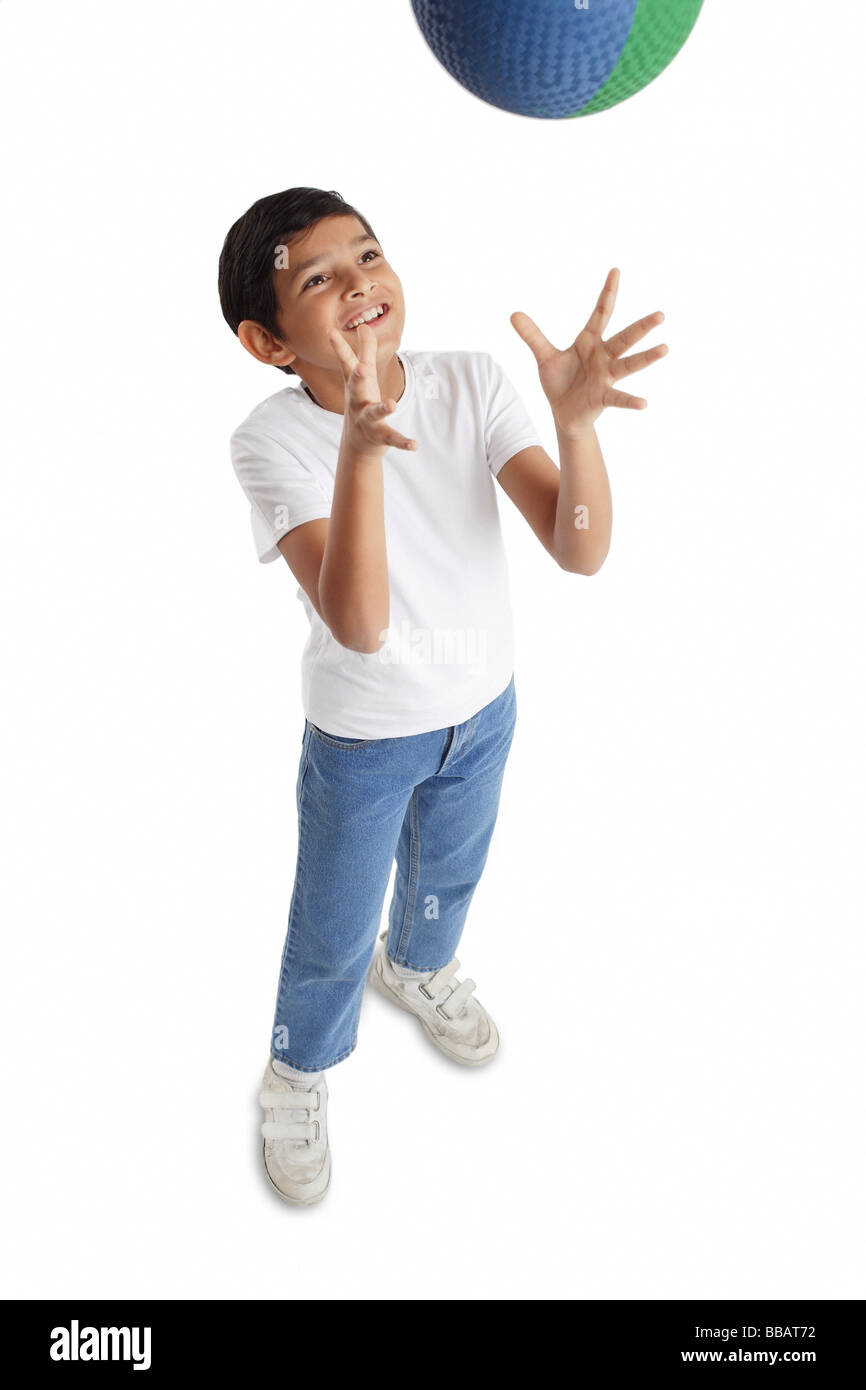 Boy throwing basketball in air Stock Photo - Alamy